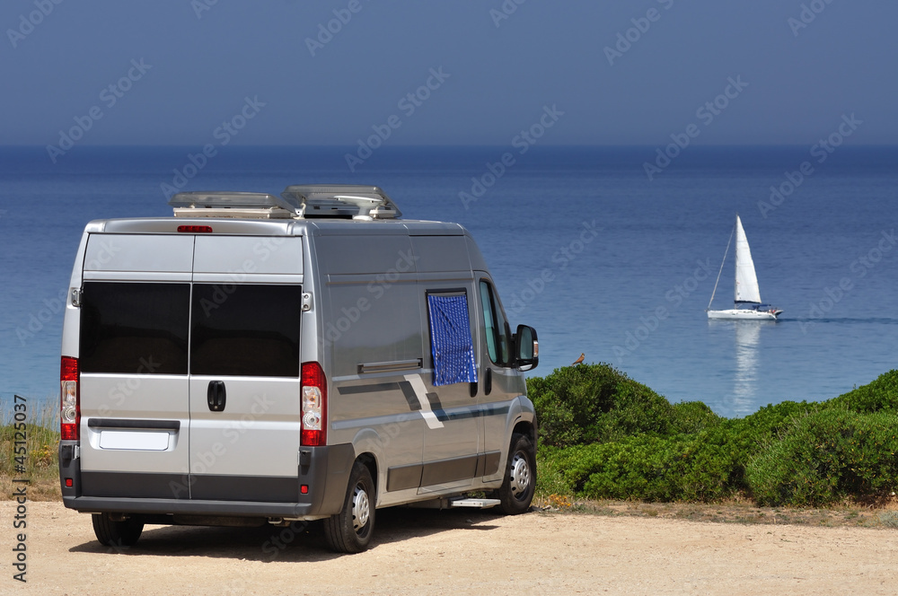Camper van on the beach Stock Photo | Adobe Stock