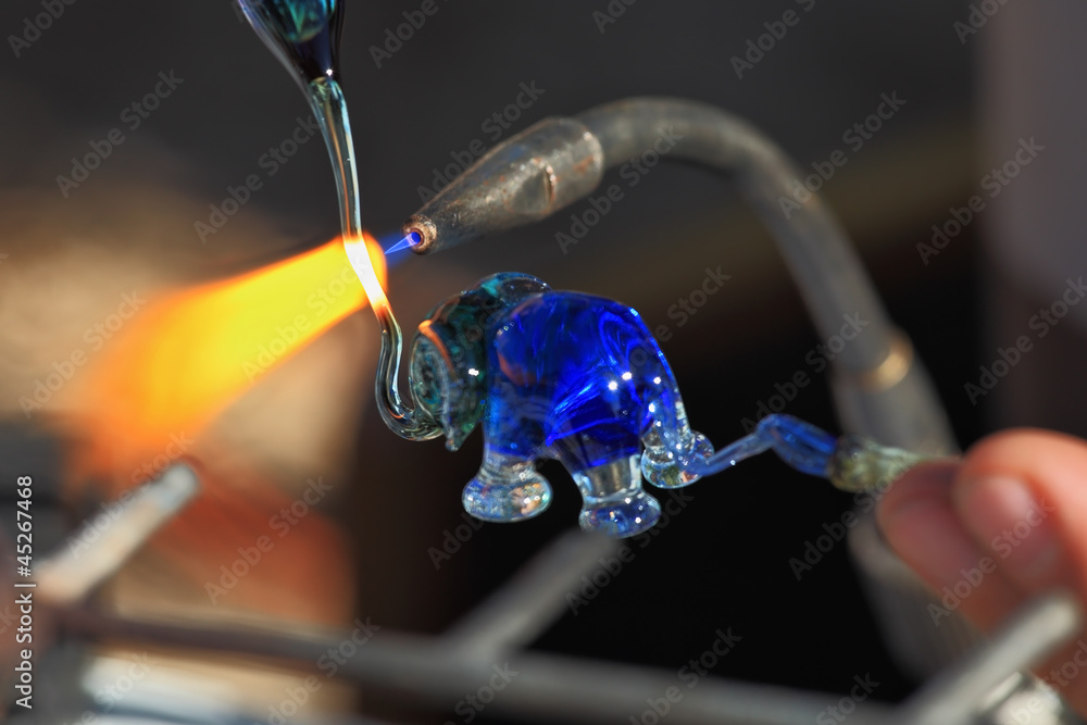 The photo shows the hand of the master and the burner flame Stock Photo ...