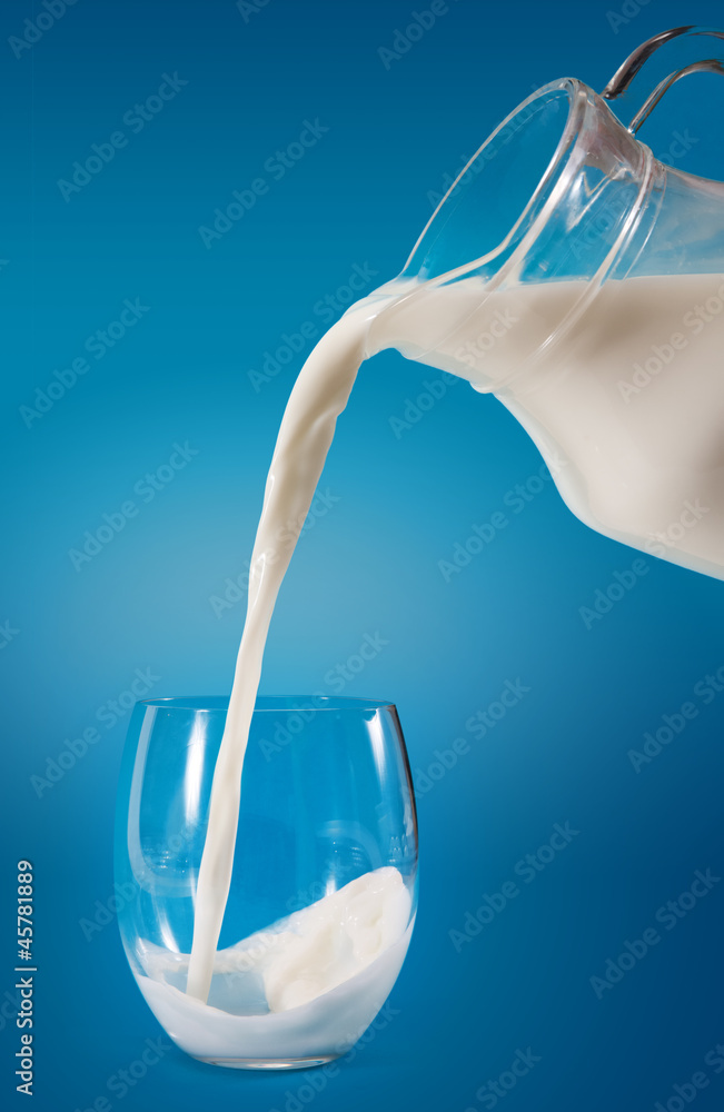 Pouring milk Stock Photo | Adobe Stock