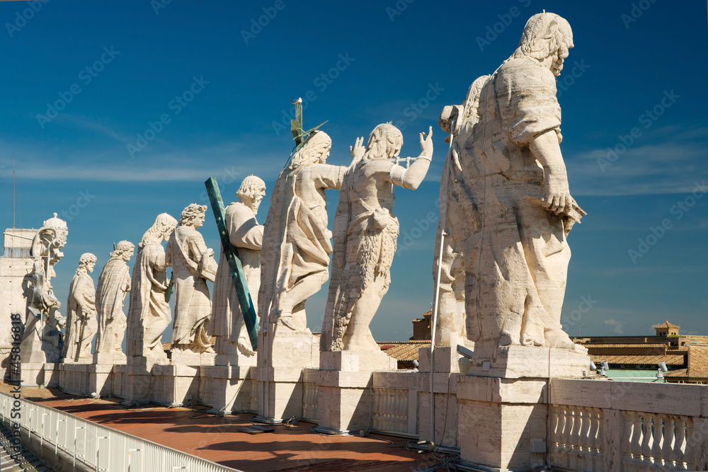 Statues of Christ and apostles on St Peter`s basilica roof, Rome, Italy ...