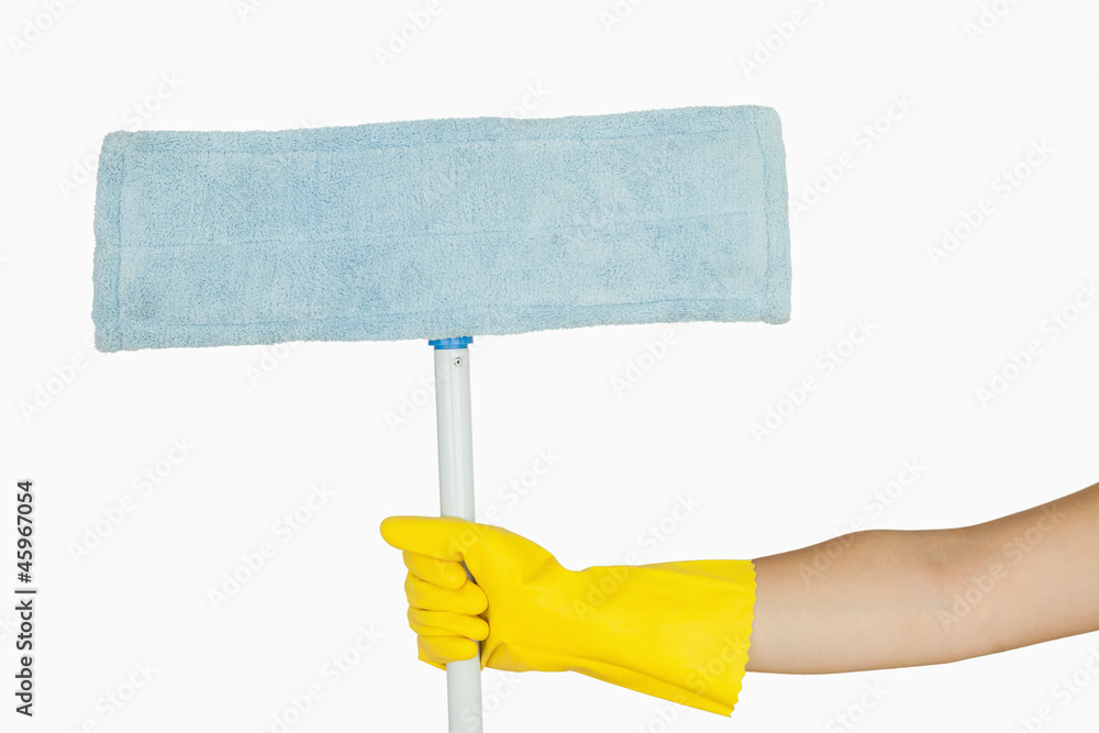 Hand holding mop Stock Photo | Adobe Stock