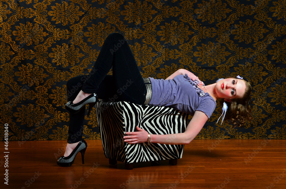 Sexy woman laying back on a footstool Stock Photo | Adobe Stock