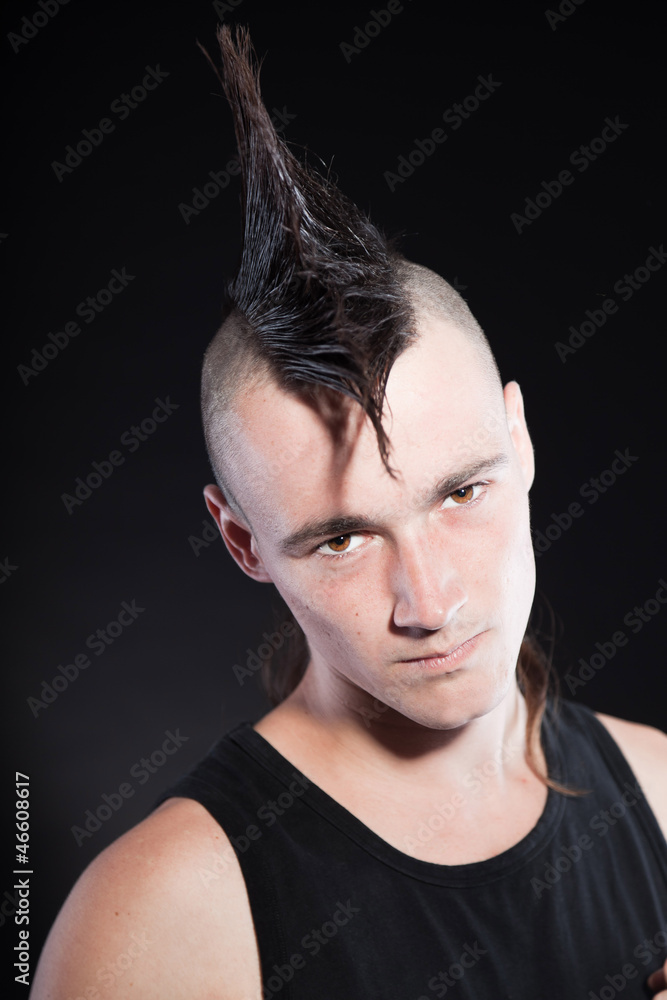 Punk rock man with mohawk haircut against black background. Stock Photo ...