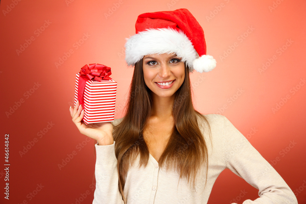 beautiful young woman with gift, on red background Stock Photo | Adobe ...