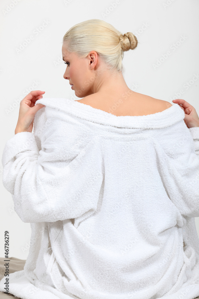 Back view of a woman disrobing Stock Photo | Adobe Stock