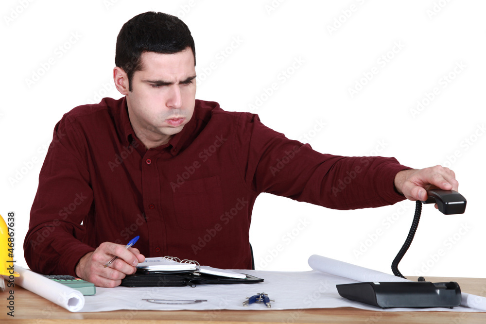Stressed man hanging up the phone Stock-Foto | Adobe Stock