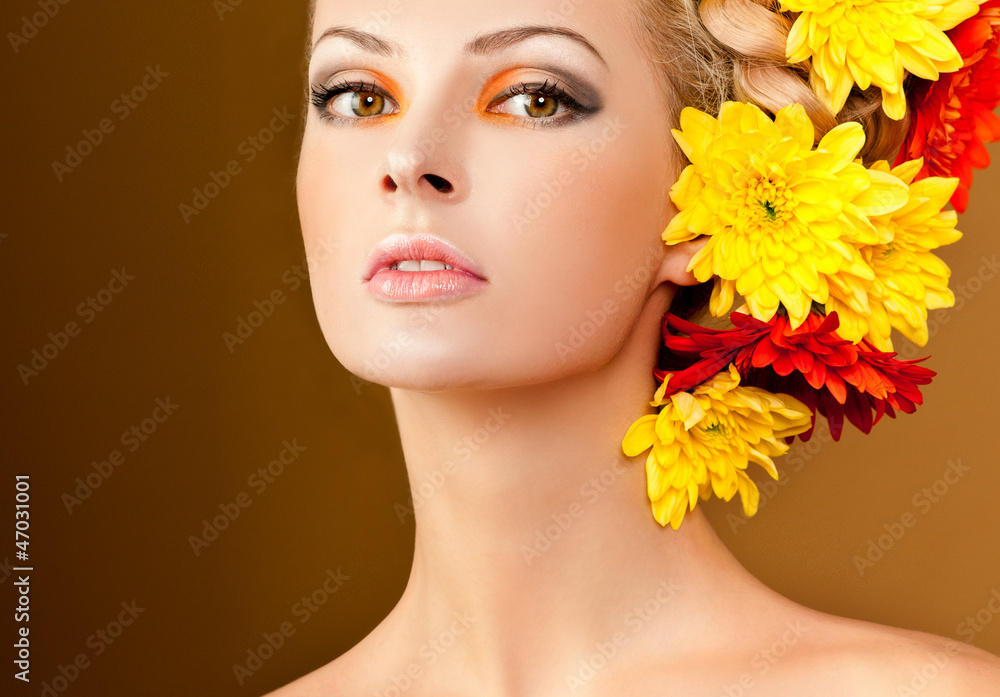 fashion model with large hairstyle and flowers in her hair. Stock Photo ...