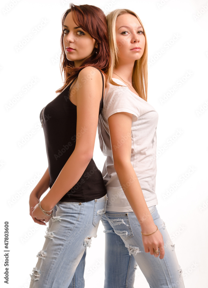 Two curvy young woman standing back to back Stock Photo | Adobe Stock