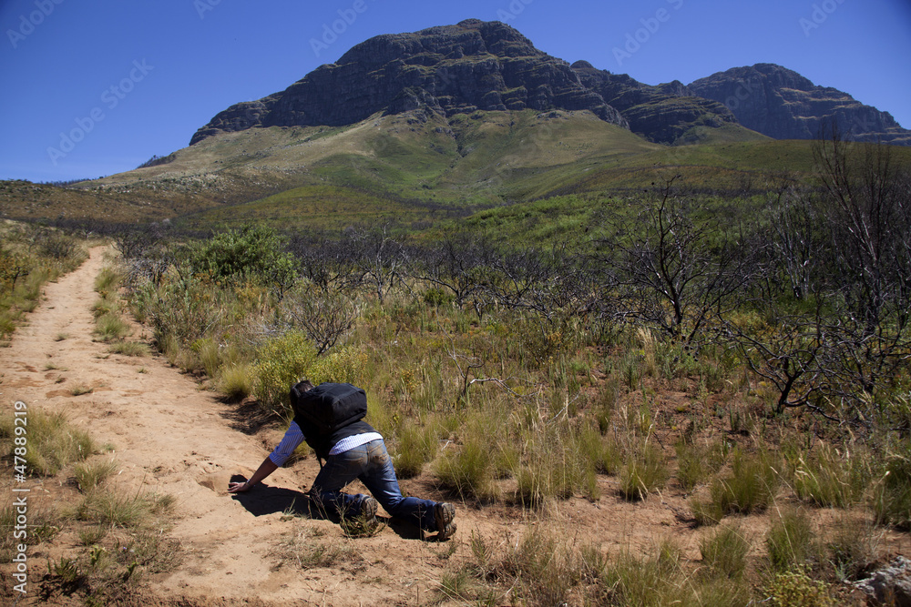 man crawling up mountain Stock Photo | Adobe Stock