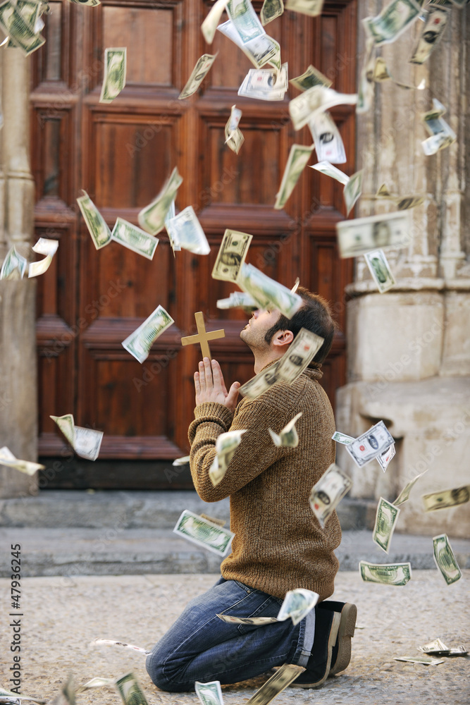 Man praying and money falling from the sky Stock Photo | Adobe Stock