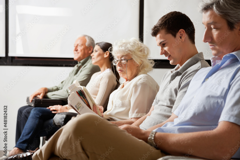 People Waiting In Lobby Stock Photo | Adobe Stock