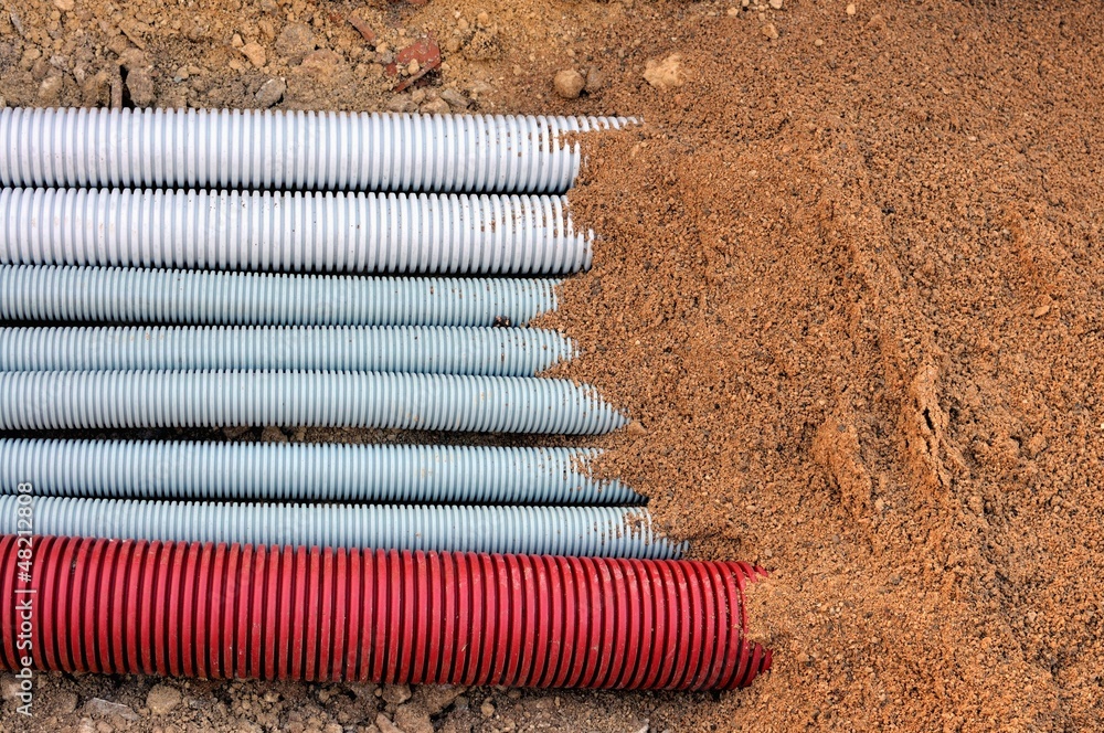 beam corrugated underground conduits covered with sand Stock Photo ...