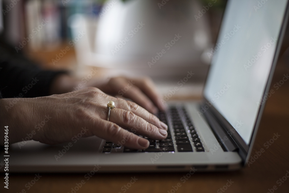 Working on laptop Stock Photo | Adobe Stock