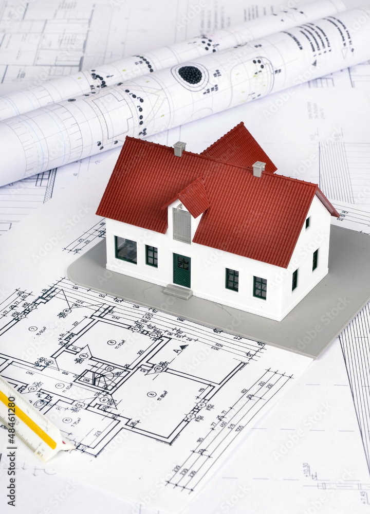 House model on a plan of a house construction Stock Photo | Adobe Stock