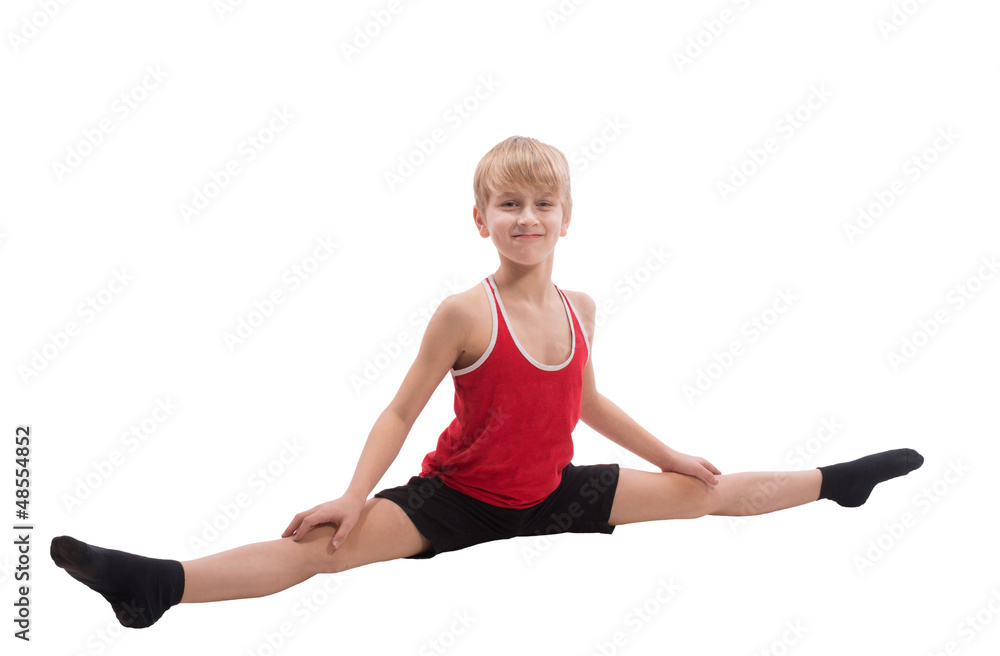 Smiling boy doing horizontal splits, white background Stock Photo ...