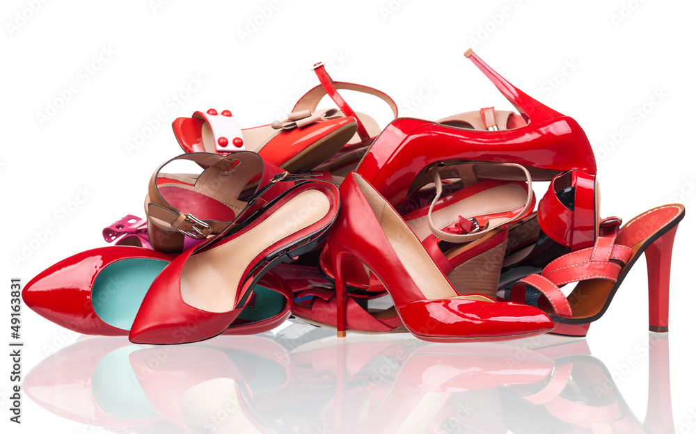 Pile of various red female shoes over white Stock Photo | Adobe Stock