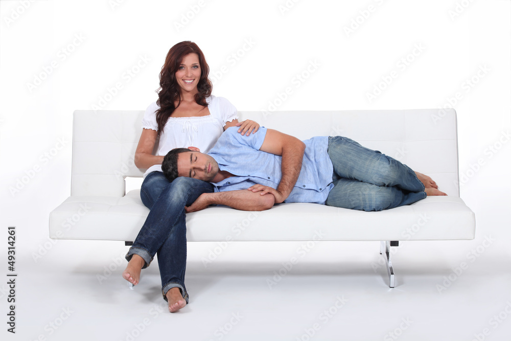Sleeping man with his head on his girlfriend's lap Stock Photo | Adobe ...