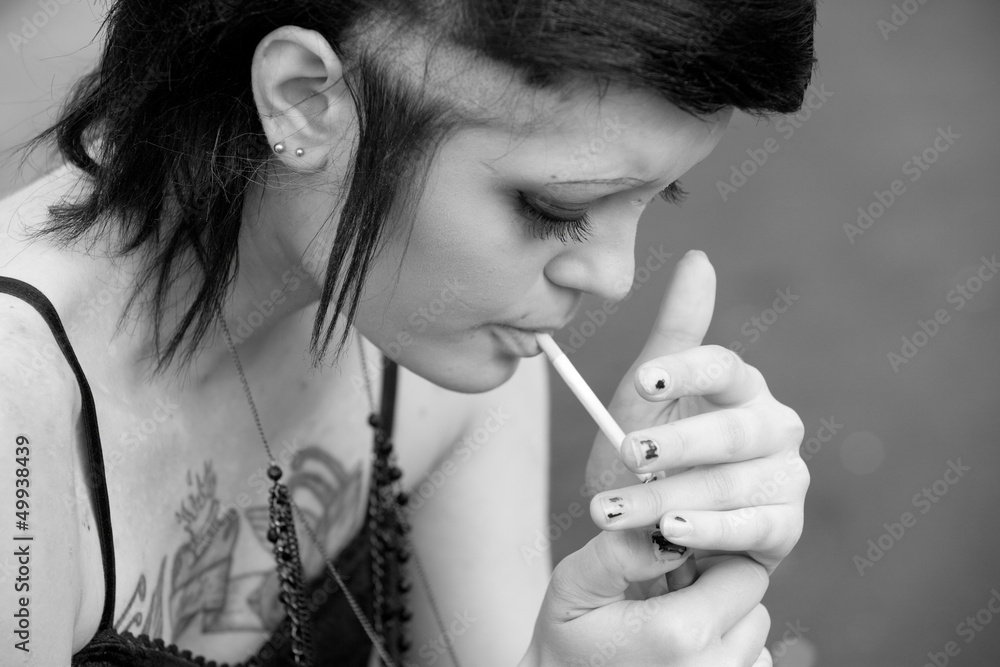punk girl smokes a cigarette Stock Photo | Adobe Stock