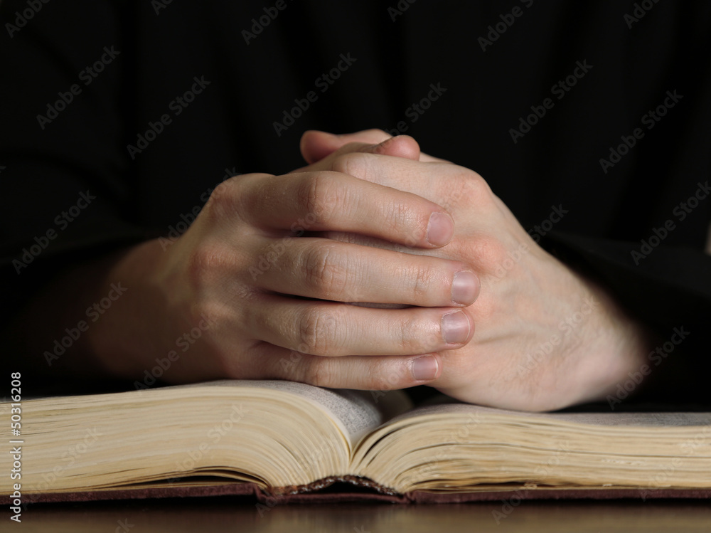 Priest reading from the holy bible, close up Stock Photo | Adobe Stock