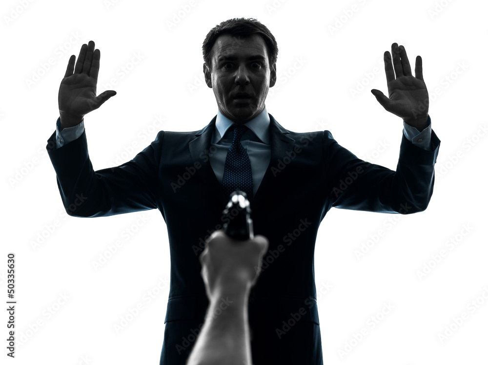 business man arms raised with gun pointing at him silhouette Stock ...