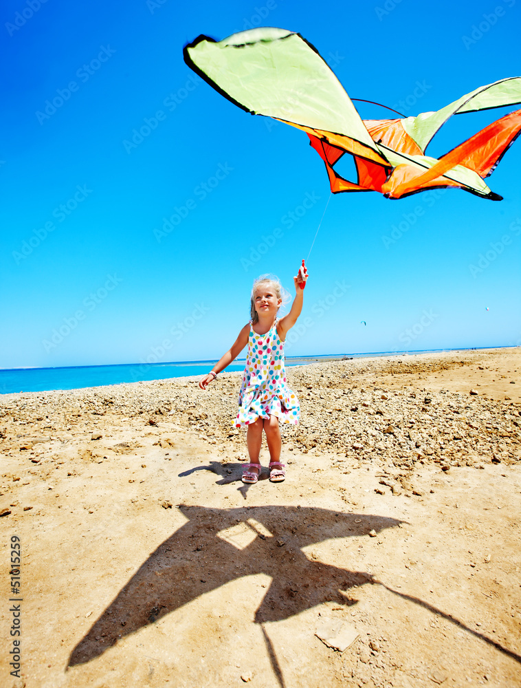 Kid flying kite outdoor. Stock Photo | Adobe Stock