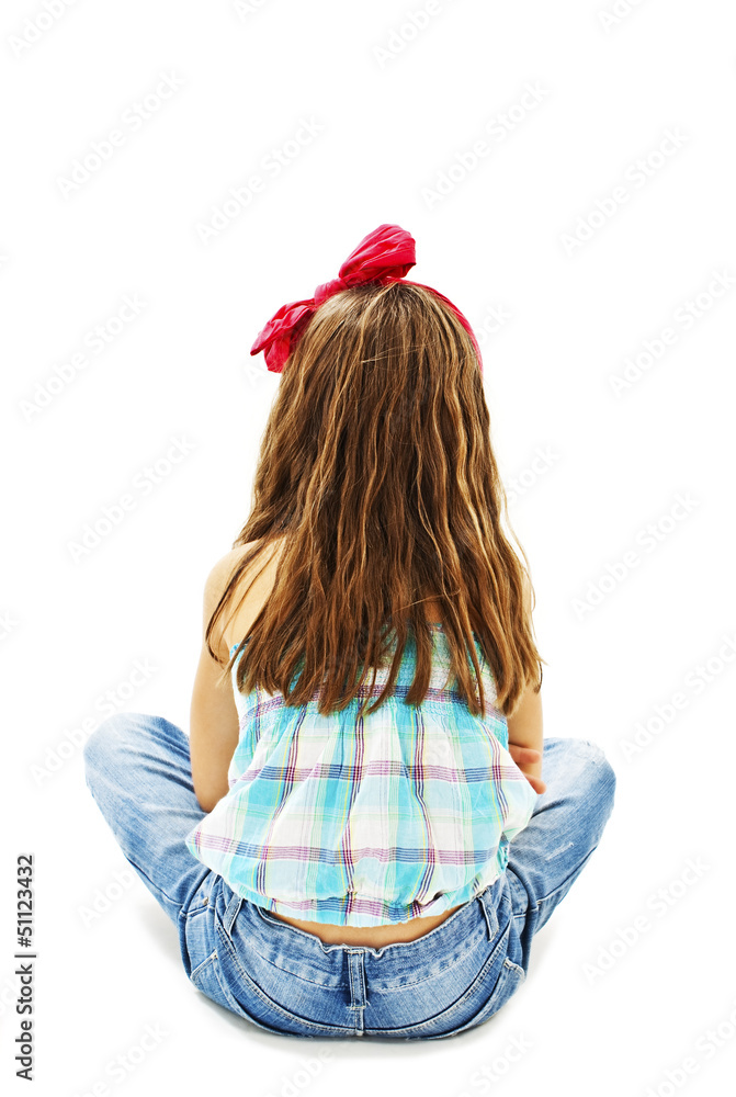 Rear view of little girl sitting on floor Stock Photo | Adobe Stock