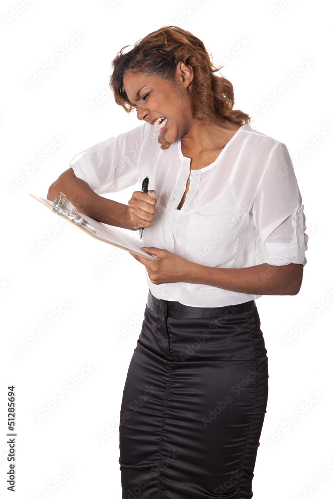 Angry woman scratches out notes on a clipboard. Stock Photo | Adobe Stock