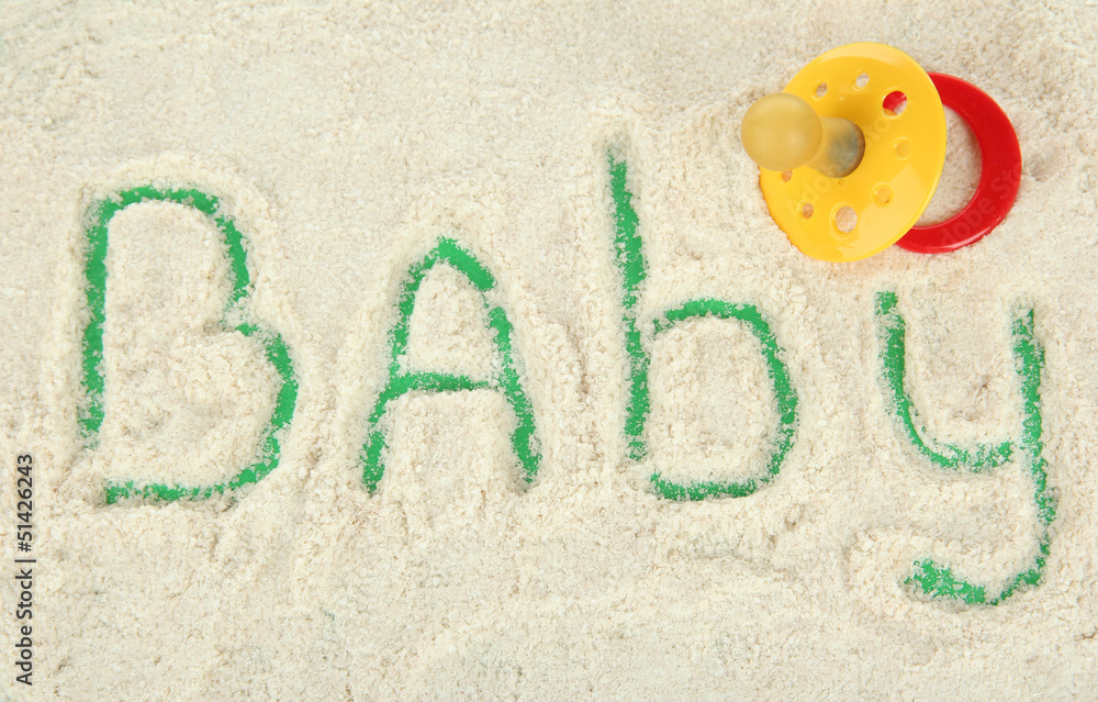Word baby making with powdered milk on green background Stock Photo ...
