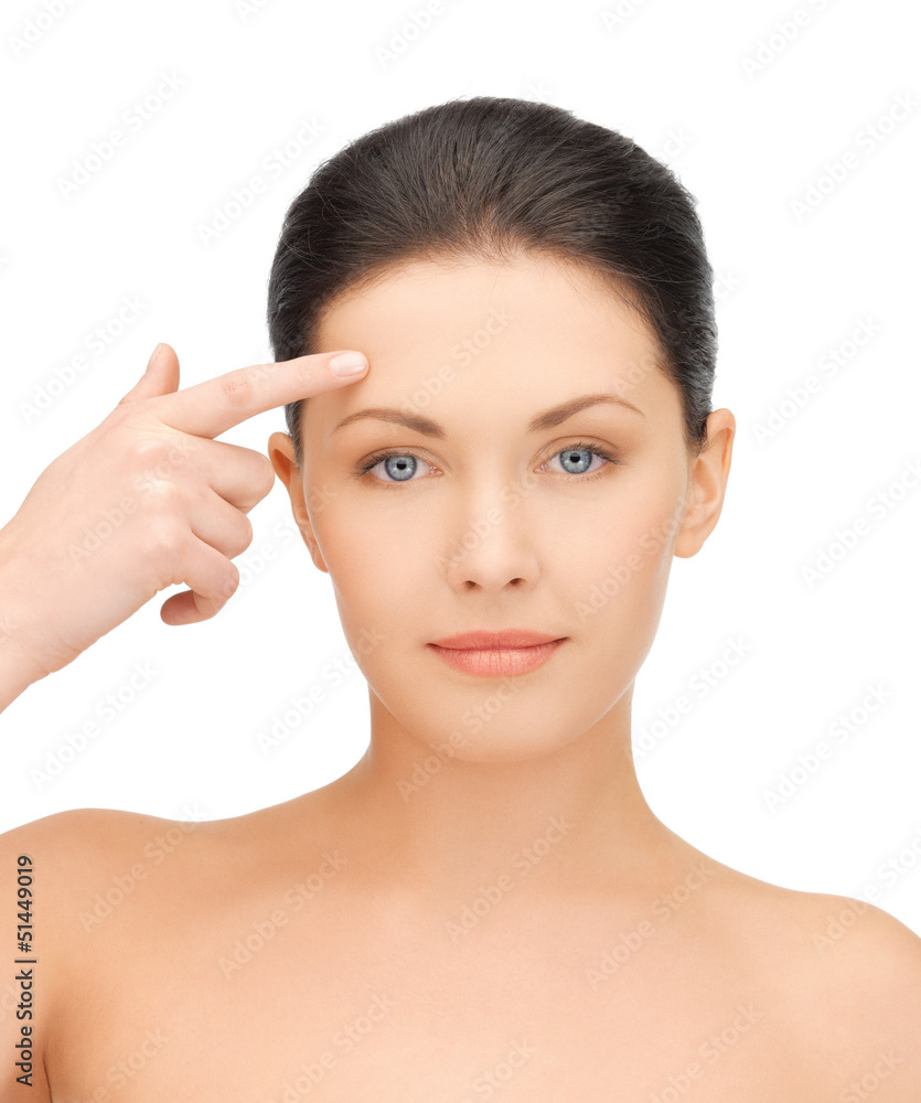 beautiful woman touching her forehead Stock Photo | Adobe Stock