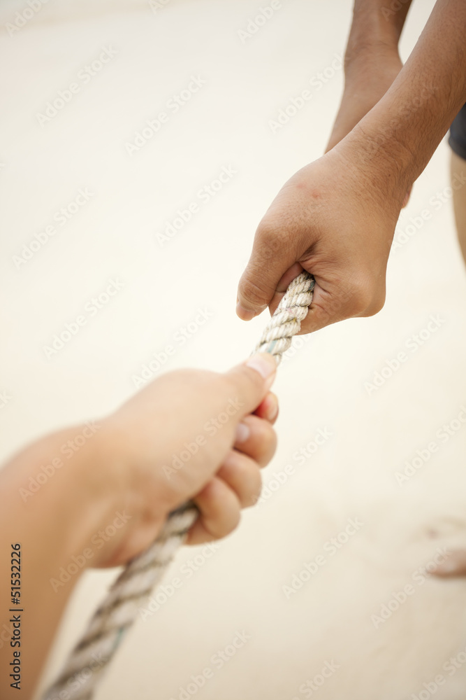 rope fight, two sides of hand pulling rope to oneself Stock Photo ...