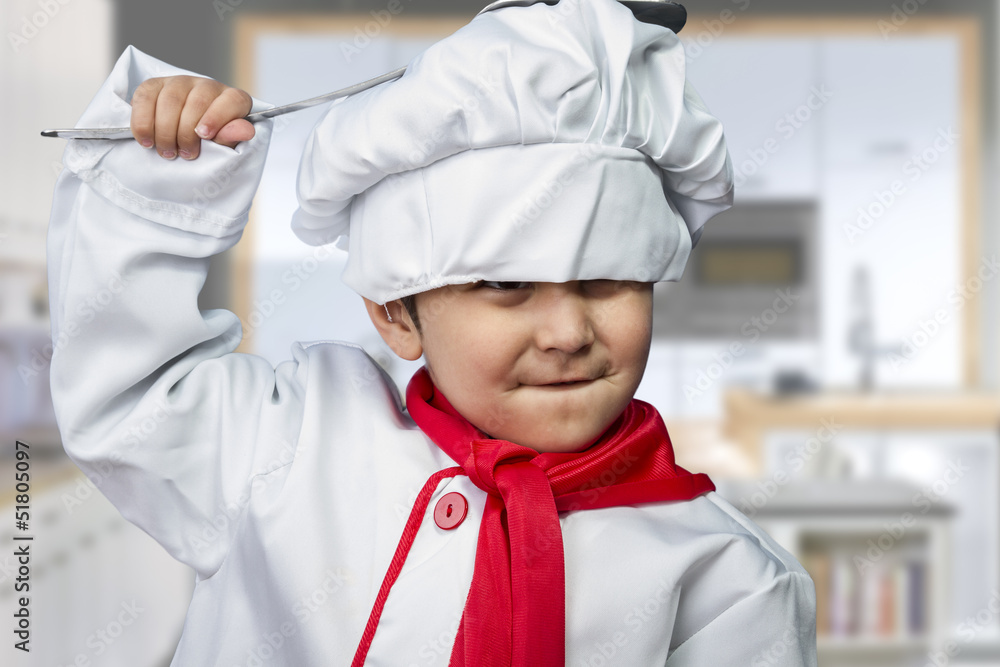 funny child dressed as a cook with a pan hitting the head Stock Photo ...