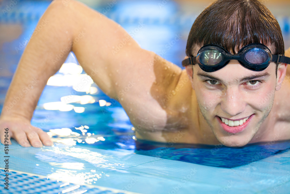 Happy attractive man swimming in blue water in swimming pool Stock ...