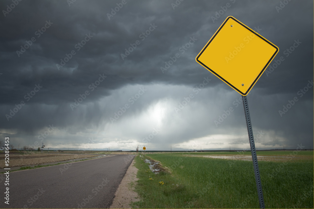 Road sign with Left Turn Arrow and Ominous Storm Background Stock Photo ...