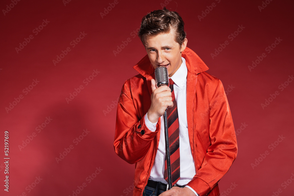 Retro fifties singer wearing red jacket with jeans and tie. Vint Stock ...