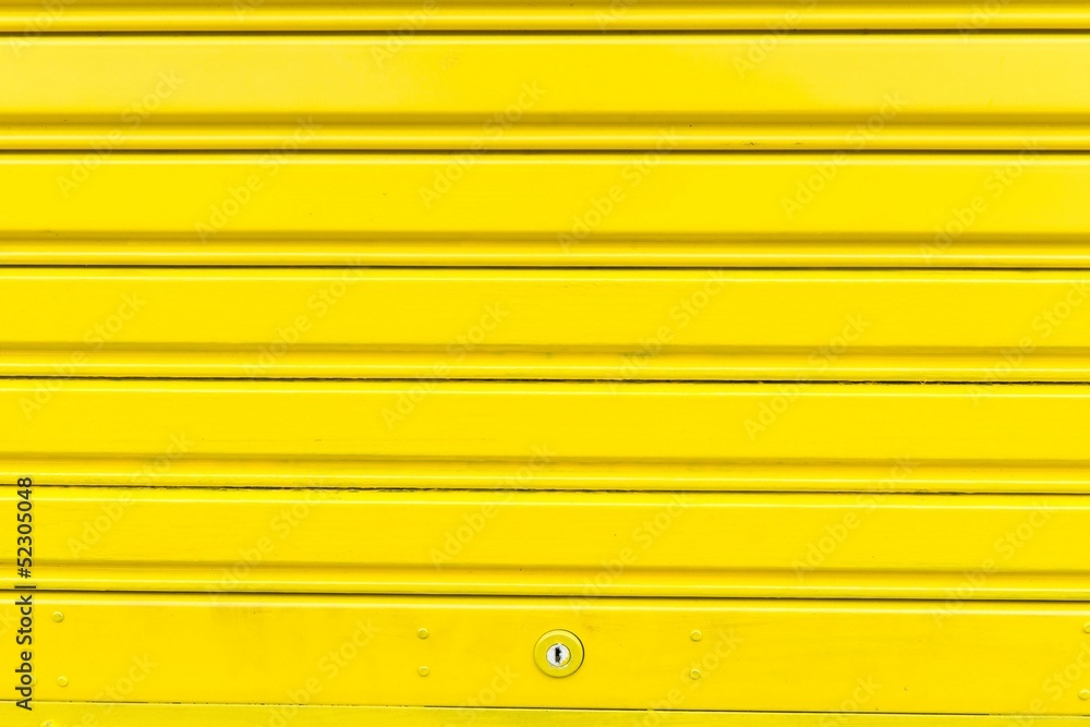 Bright yellow metal sliding door with key hole Stock Photo | Adobe Stock