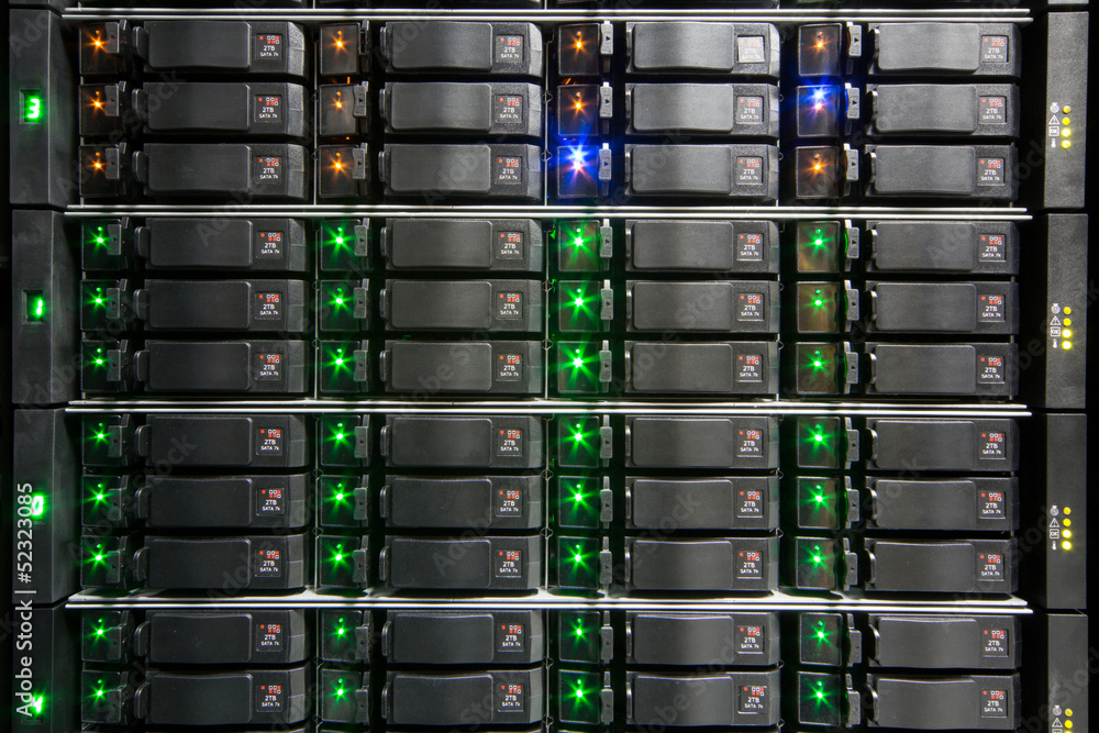 Server rack with multiple hard drives. Stock Photo | Adobe Stock
