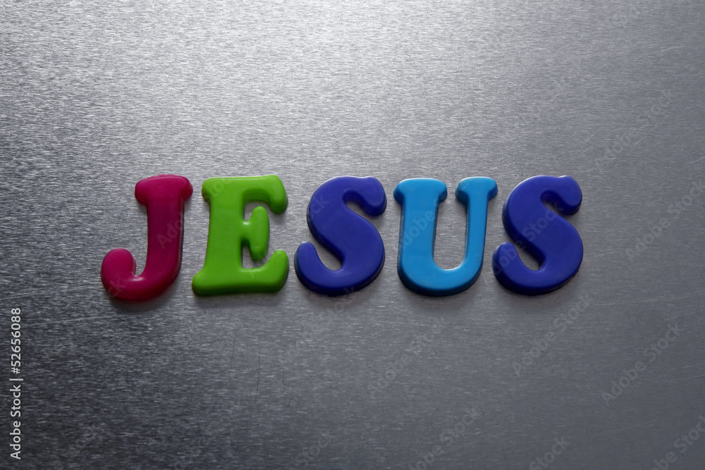jesus word spelled out using colored fridge magnets Stock Photo | Adobe ...