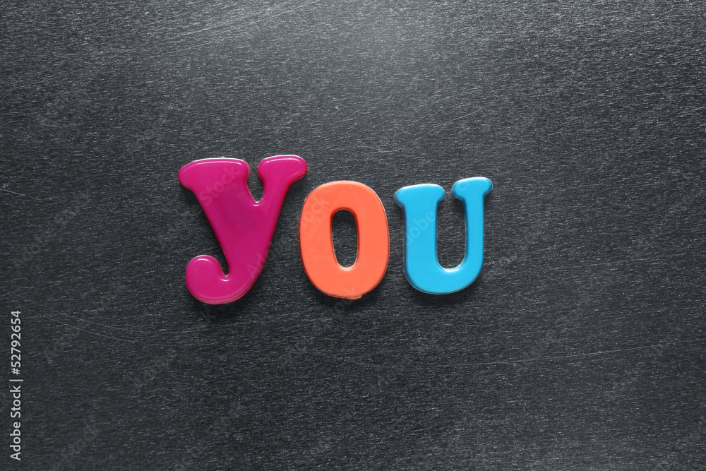 word you spelled out using colored fridge magnets Stock Photo | Adobe Stock