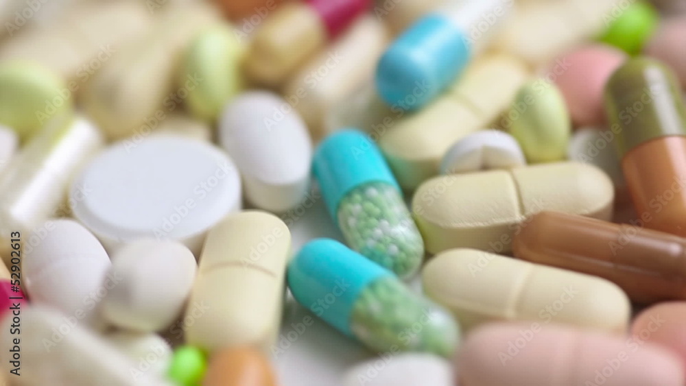 Colorful pills and drugs turning in loop Stock Video | Adobe Stock