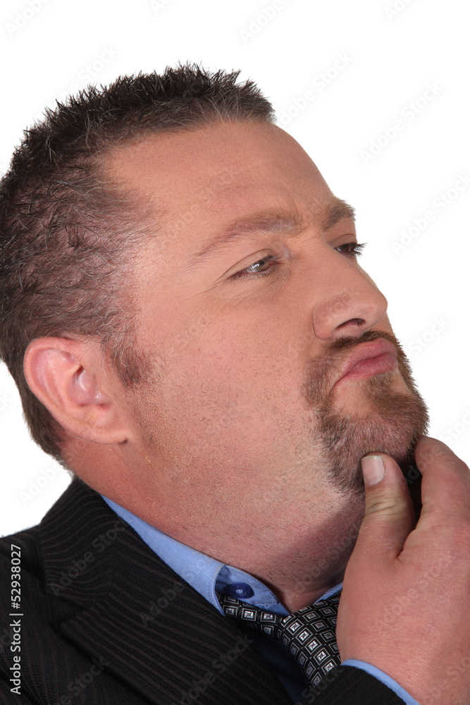 Man scratching his chin Stock Photo | Adobe Stock