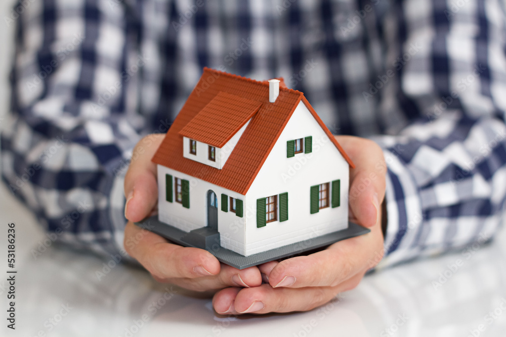 Hand over mini house Stock Photo | Adobe Stock