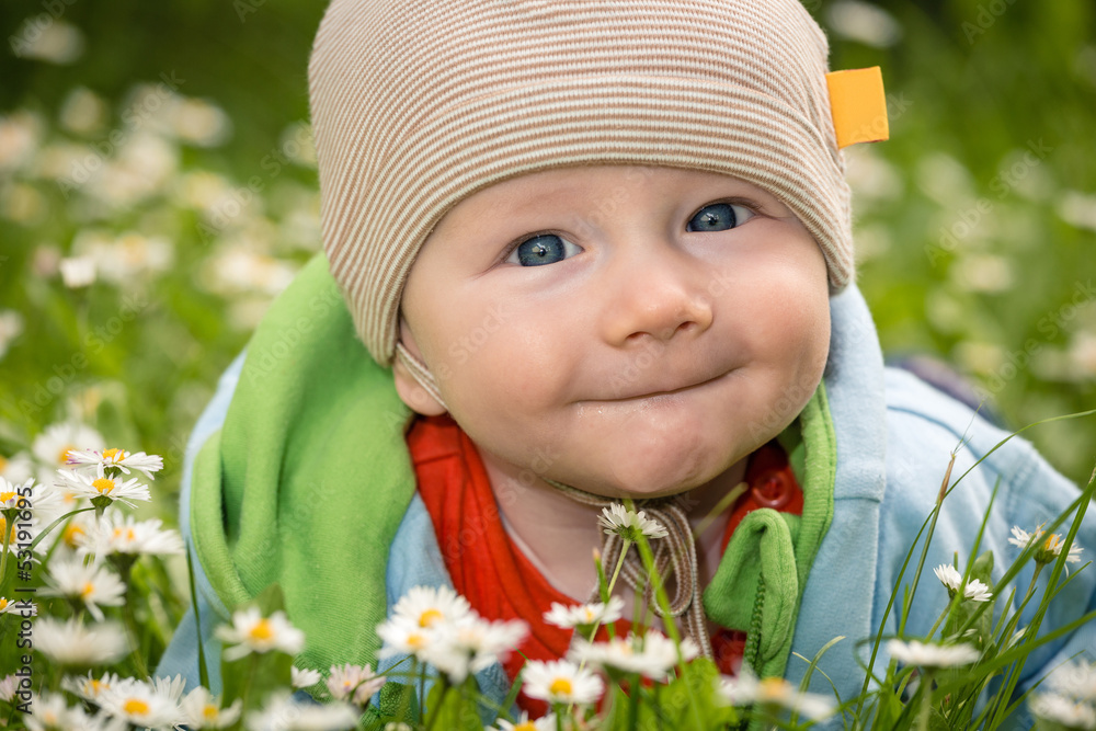 Baby auf der Blumenwiese Stock Photo | Adobe Stock