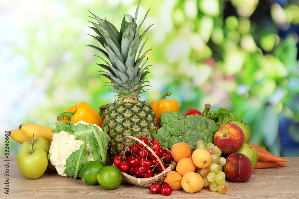 Assortment of fresh fruits and vegetables on natural background Stock ...