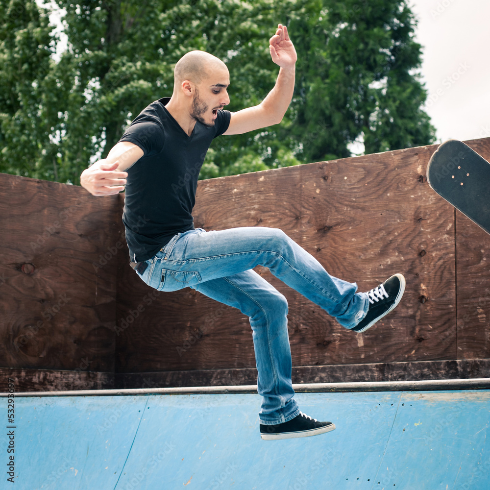 Skateboarder falling from halfpipe at skatepark. Stock Photo | Adobe Stock