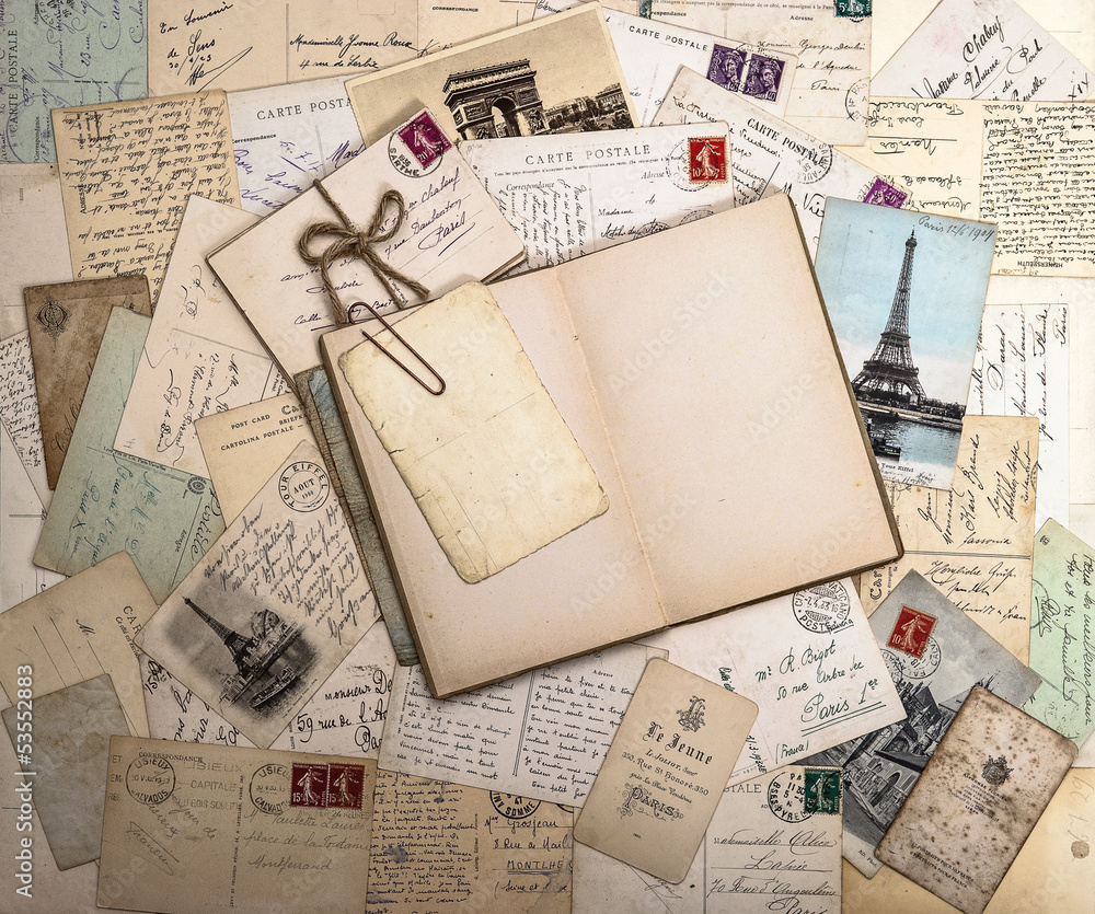 old postcards and open book. nostalgic vintage background Stock Photo ...