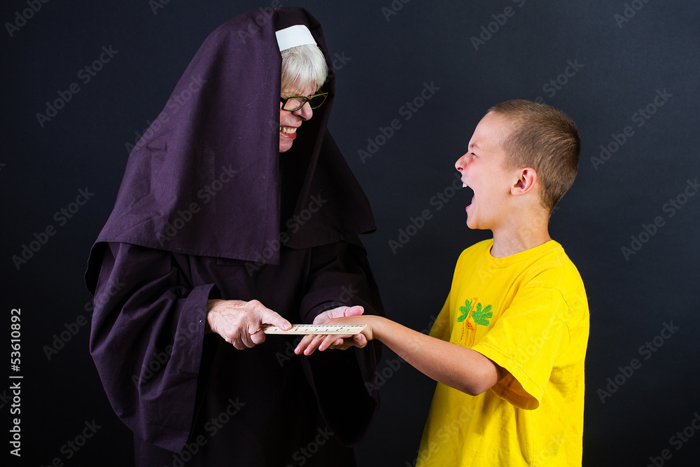 nun hits boy with a ruler Stock Photo | Adobe Stock