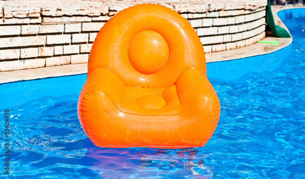 Inflatable armchair in the pool Stock Photo | Adobe Stock