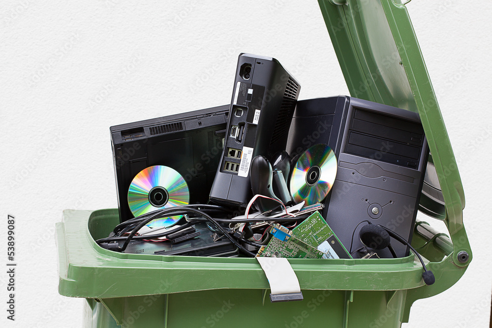 Discarded computer in litter bin Stock Photo | Adobe Stock
