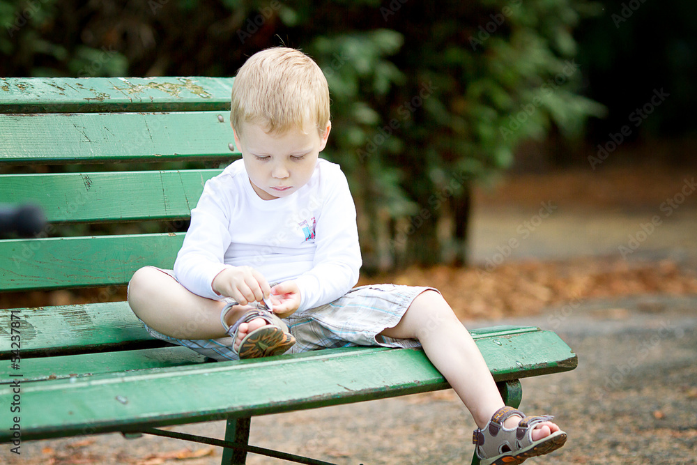 Boy Putting On Shoes