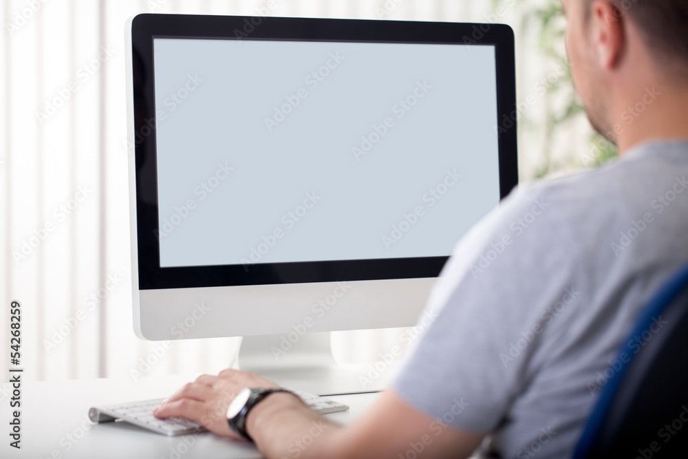 Man looks at the screen. Stock Photo | Adobe Stock